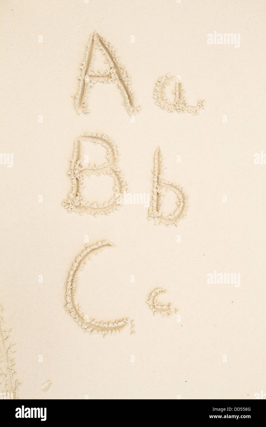 alphabet in sand Stock Photo - Alamy
