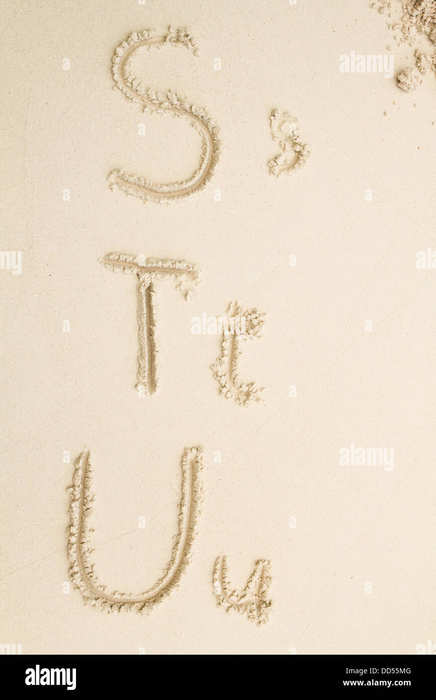 alphabet in sand Stock Photo - Alamy