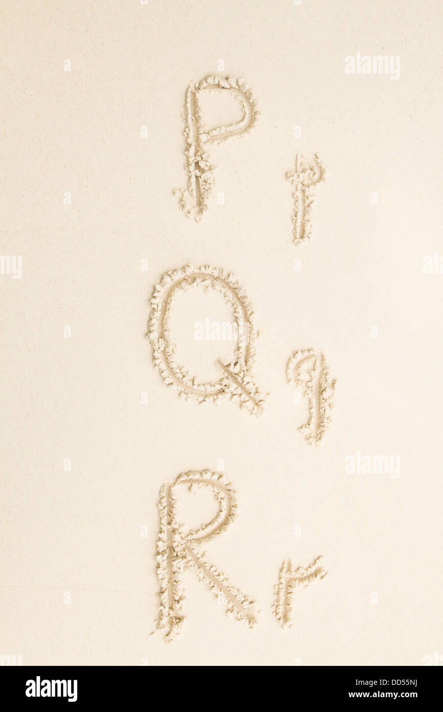 alphabet in sand Stock Photo - Alamy