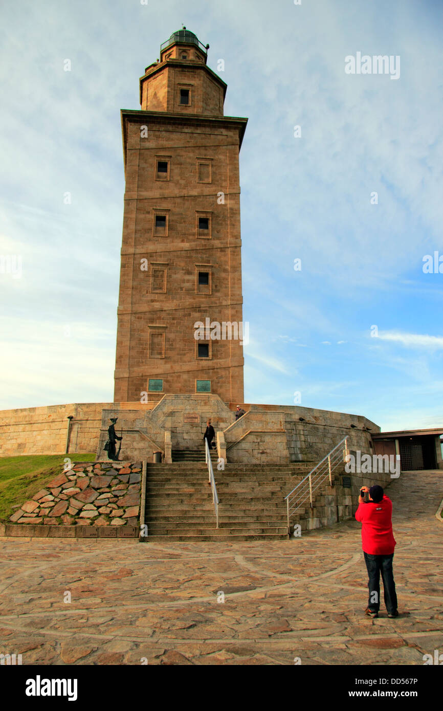 Tourist taking a photograph of the Tower of Hercules Lighthouse, A ...