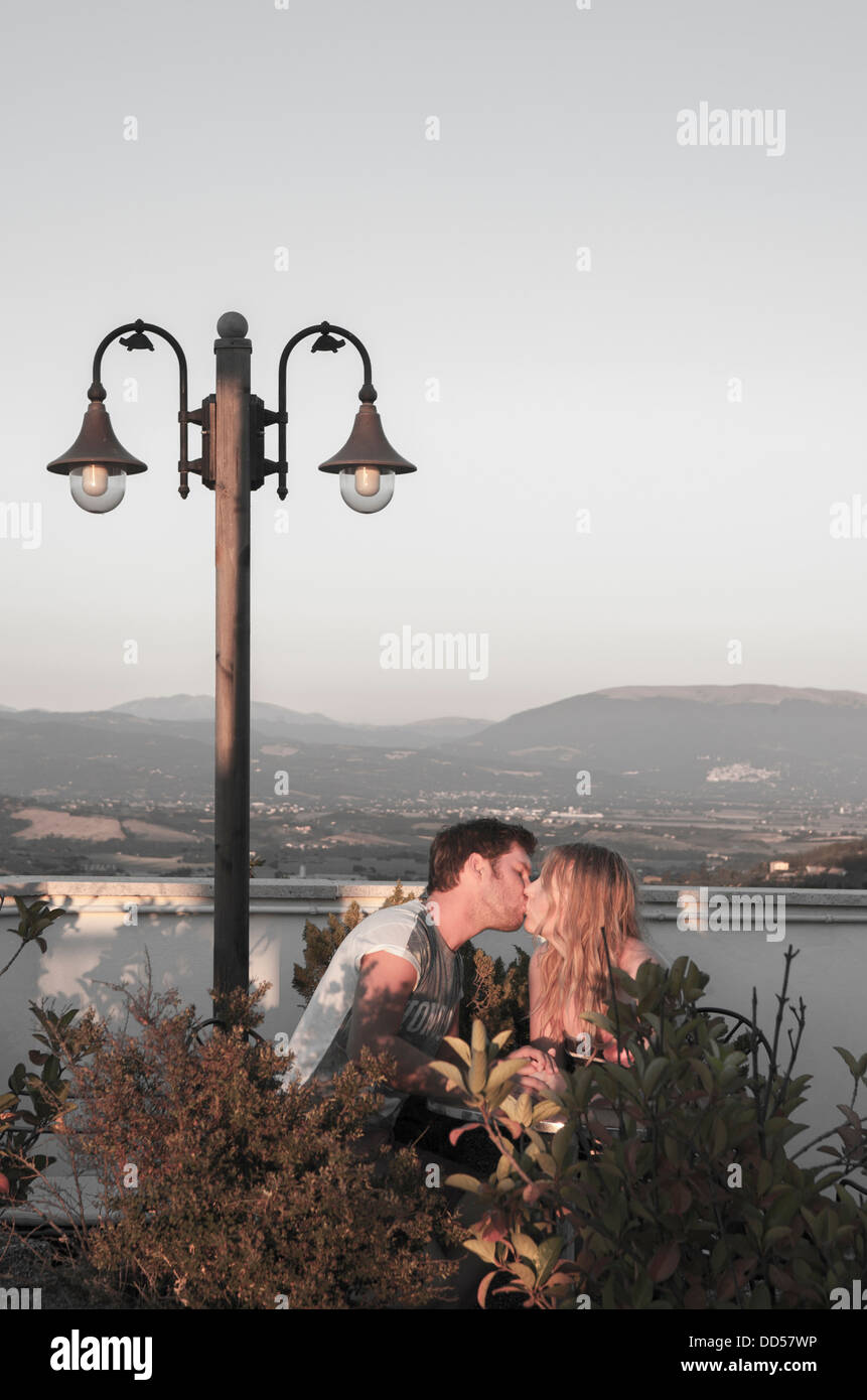 Couple kissing on balcony in hi-res stock photography and images - Alamy