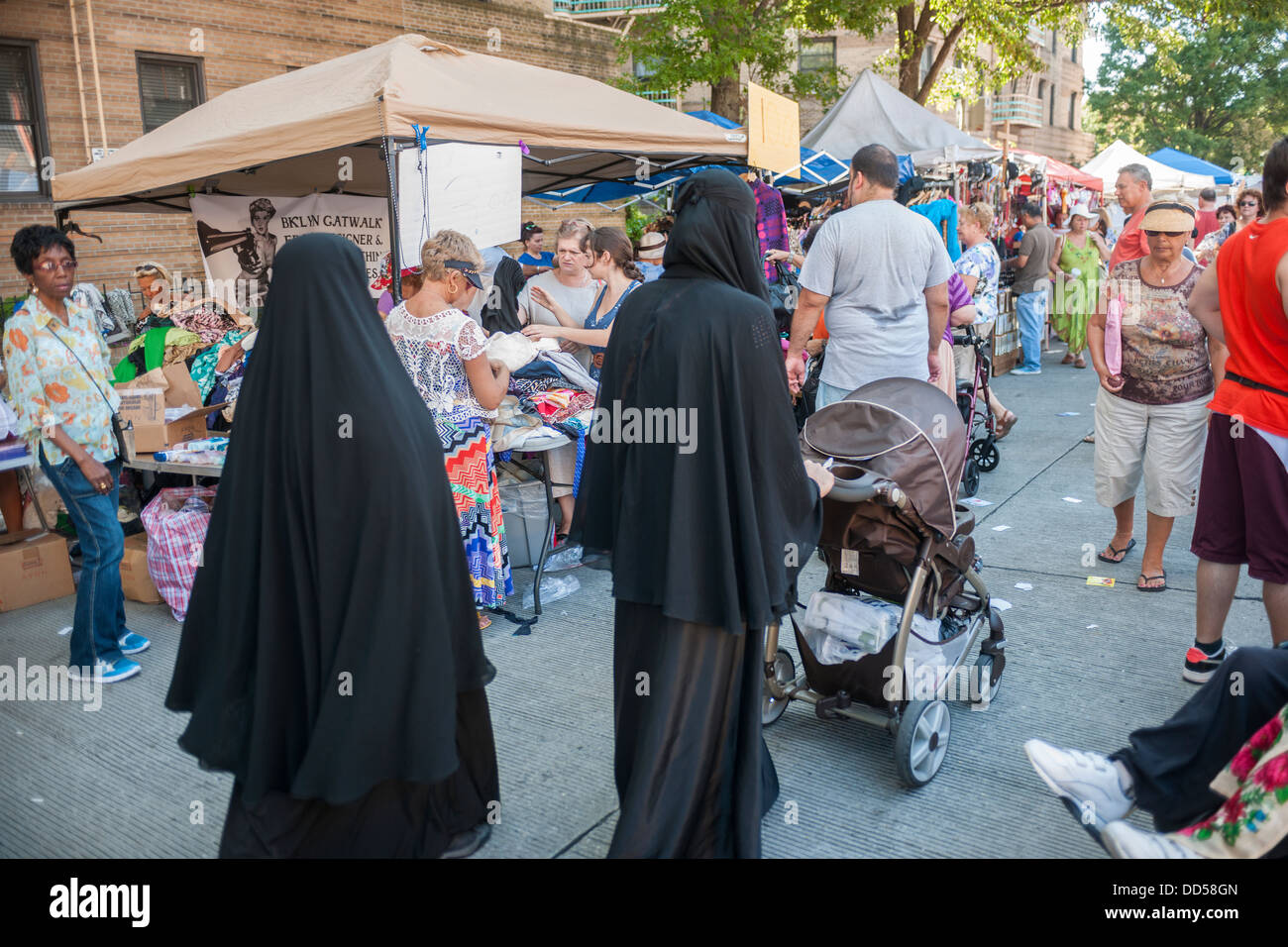 Islamic women in full burqas walk through the Brighton Beach Jubilee in ...