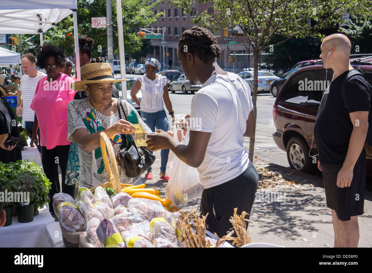 Shoppers purchase bread from the Hot Bread Kitchen at the Fortune ...