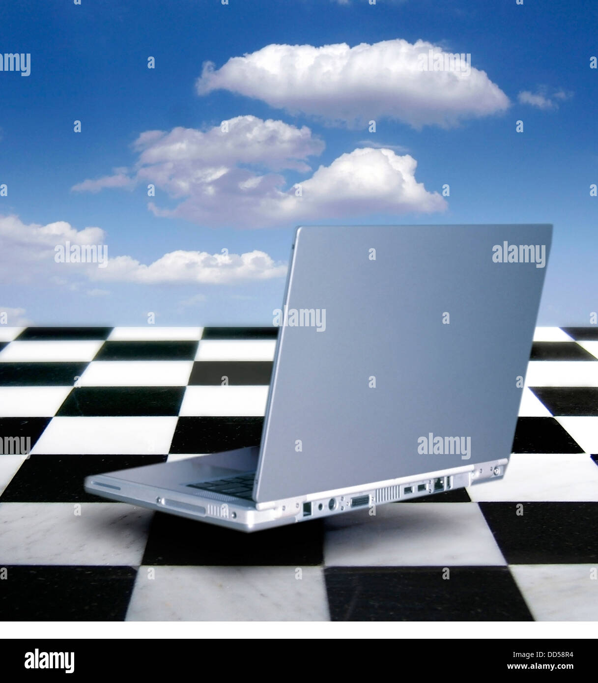 A laptop hovering over black and white tiles Stock Photo - Alamy