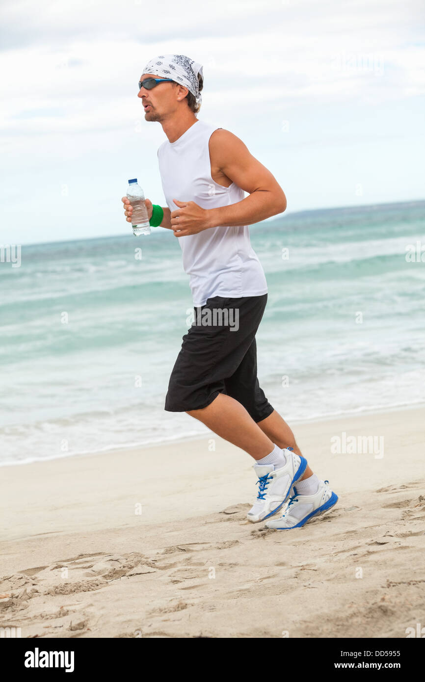 man is jogging on the beach summertime sport fitness run jogger runner ...