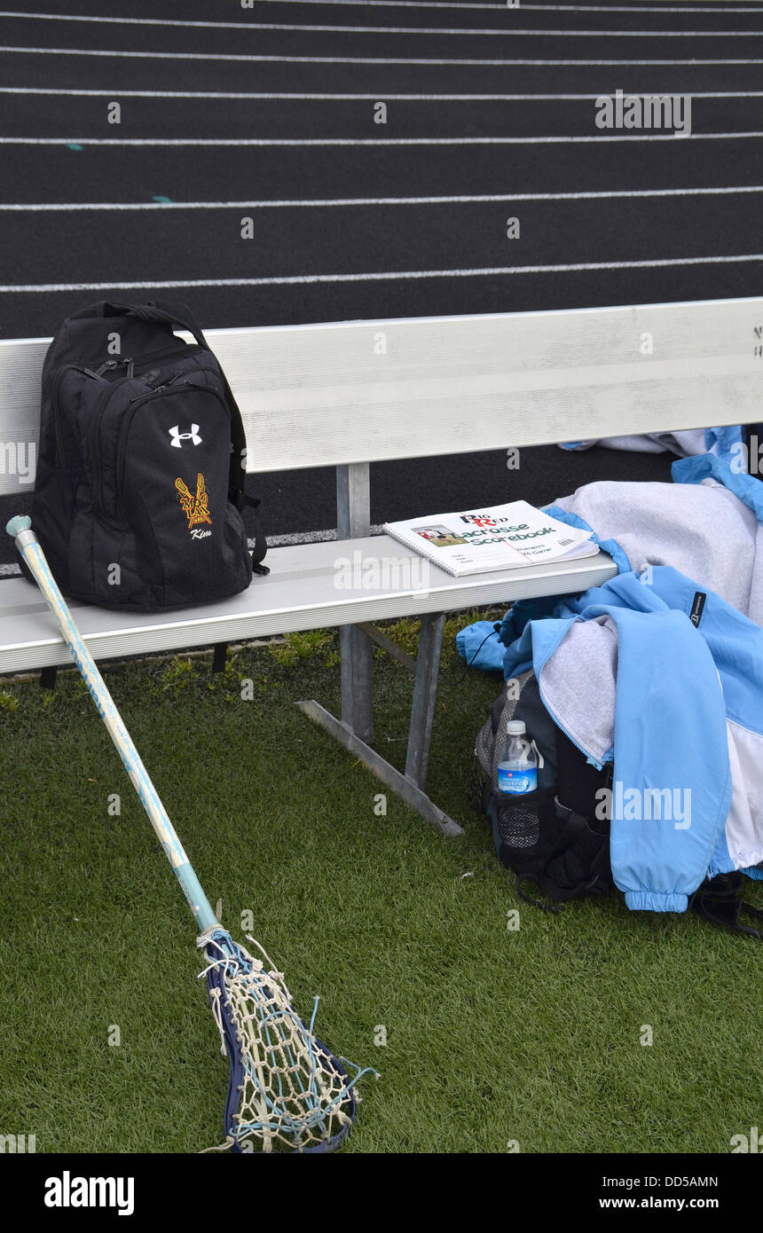 Lacrosse gear sitting on a bench Stock Photo - Alamy