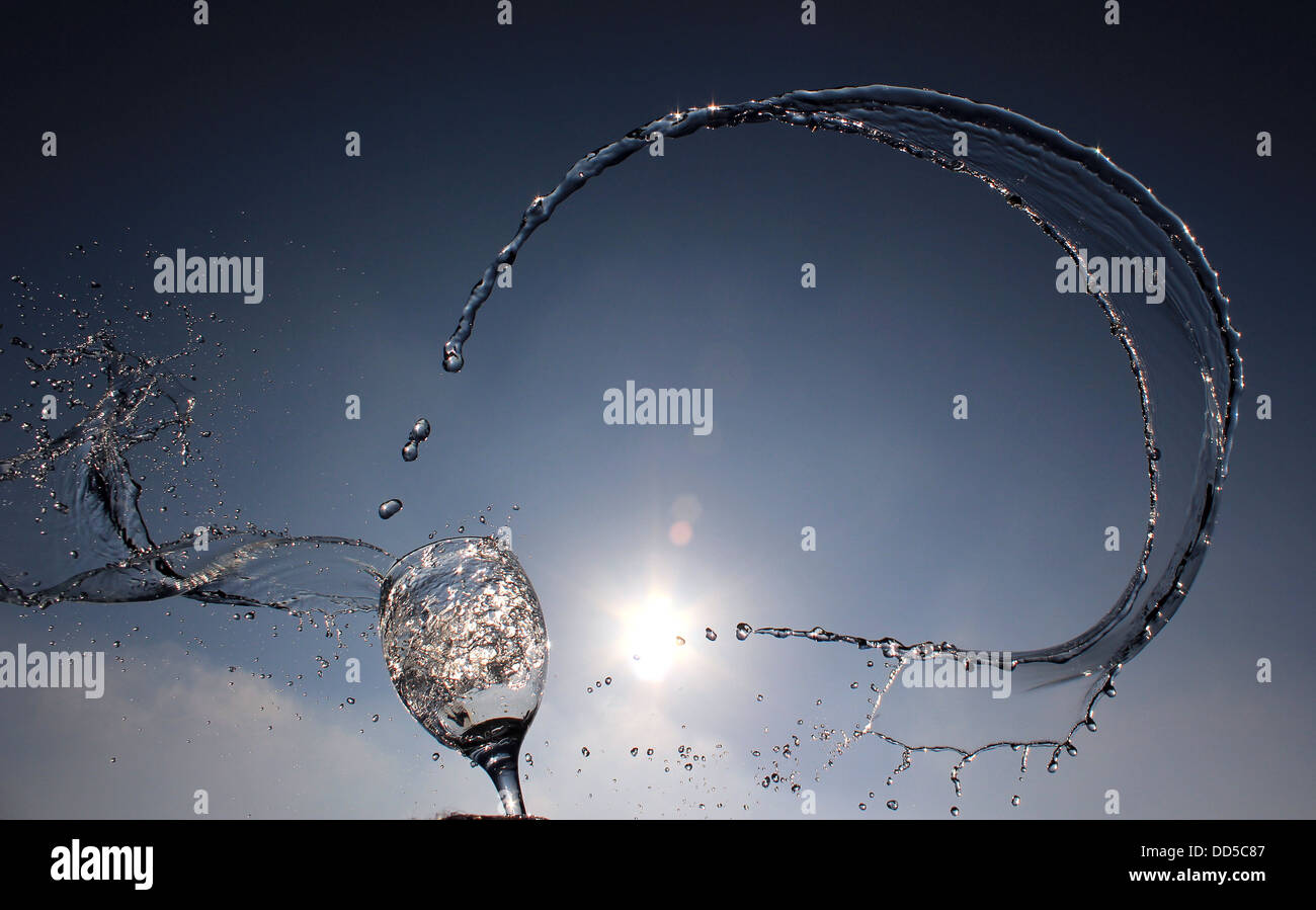 Water splashing from wine glass Stock Photo - Alamy