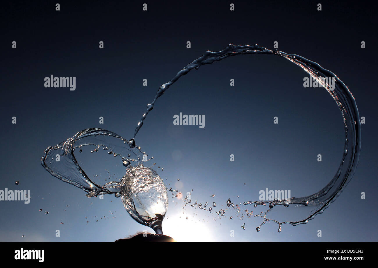Water splashing from wine glass Stock Photo - Alamy