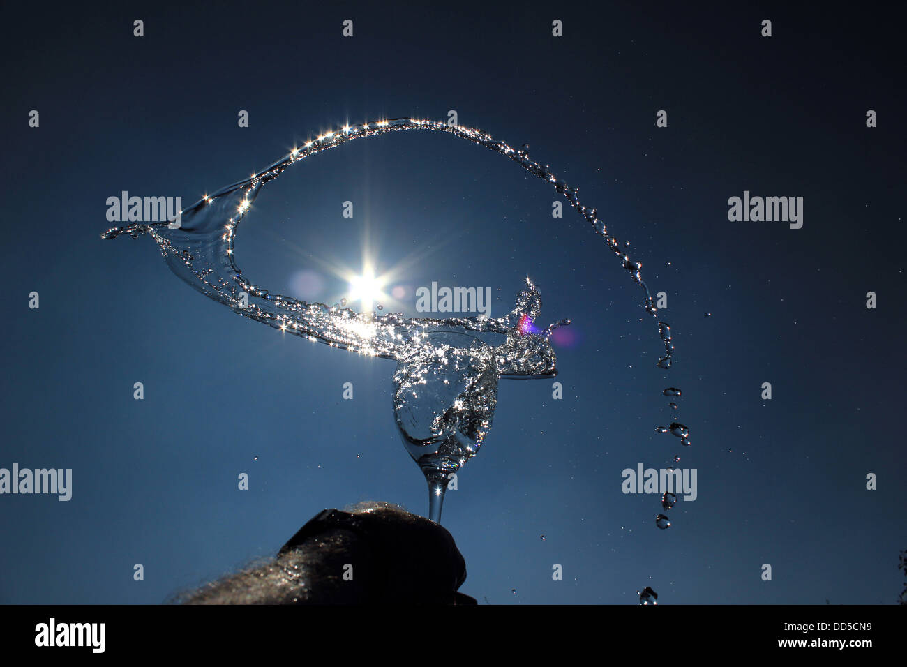 Water splashing from wine glass Stock Photo - Alamy