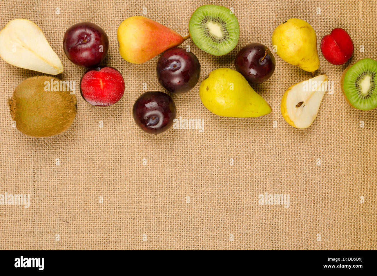 Assorted fresh fruit arranged in a background Stock Photo - Alamy