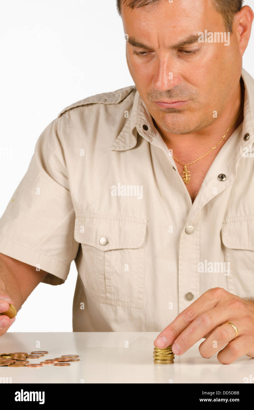 Guy counting some small change, a personal finance concept Stock Photo ...
