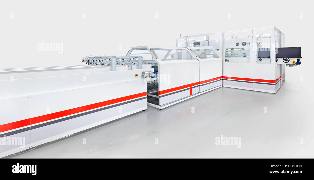 Modern packaging machine, studio isolated on gray background Stock ...