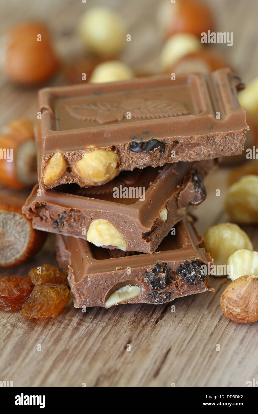 Milk chocolate with mixed nuts, close up Stock Photo - Alamy