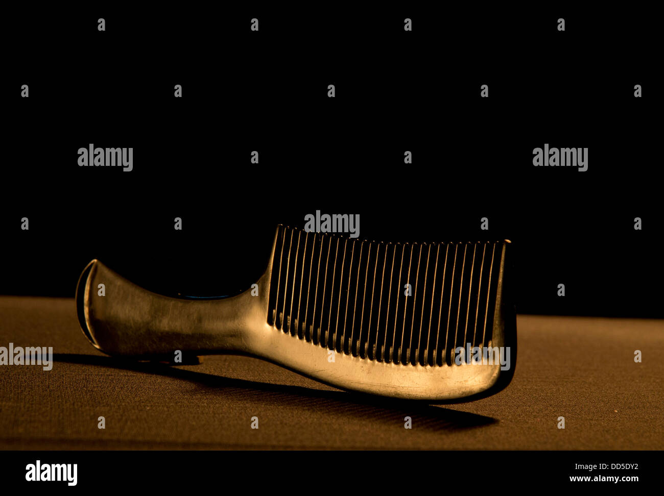 Comb on a dark background Stock Photo - Alamy