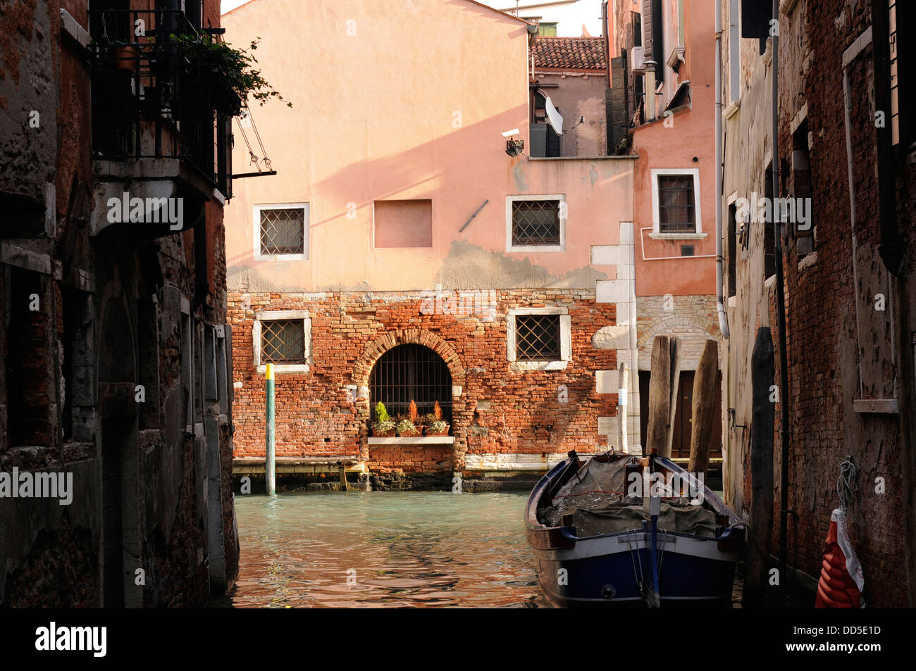 Canal Scene in Venice Italy with boats moored Stock Photo - Alamy