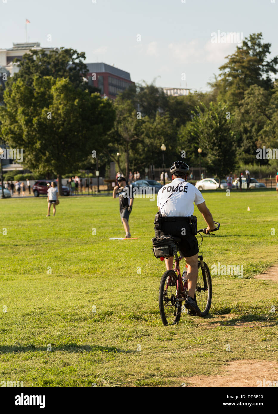United States Secret Service policeman riding a bicycle through ...