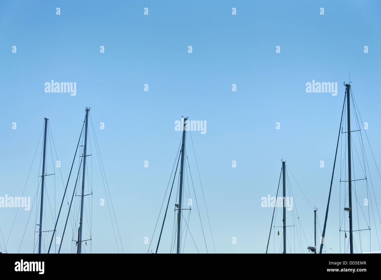 Many masts over background of a blue sky Stock Photo - Alamy