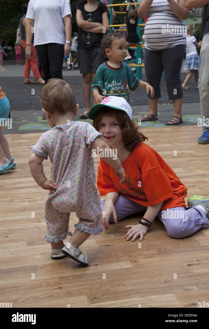 Children at a dance festival in their local playground in Brooklyn, NY ...