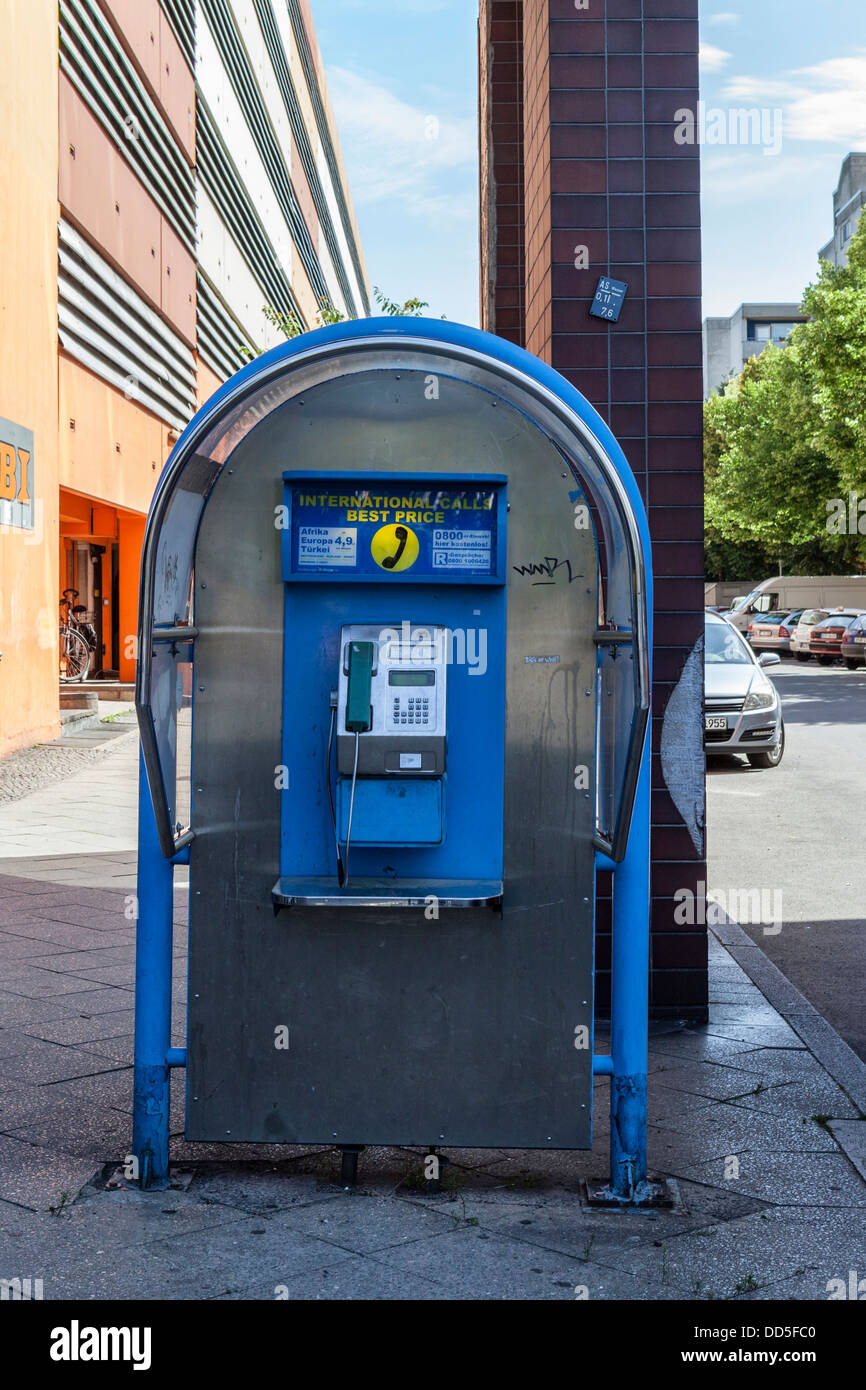 Blue telephone booth on the corner of a street in Berlin Stock Photo ...