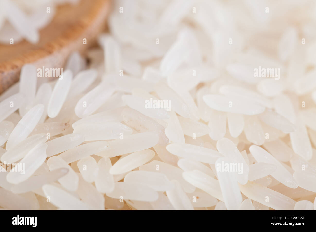 spoon with rice Stock Photo - Alamy