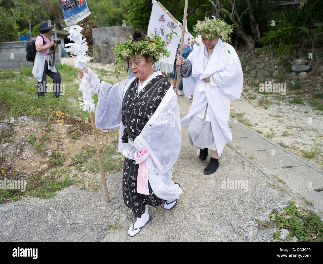Toguchi Ayako (79) leads procession to the ocean at Unjami Festival on ...