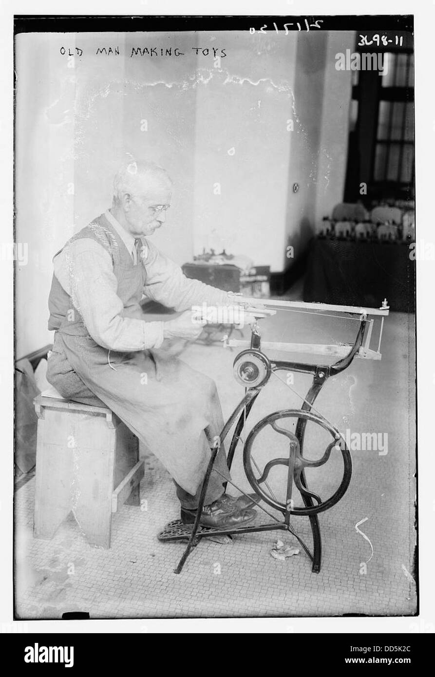 Old man making toys (LOC Stock Photo - Alamy