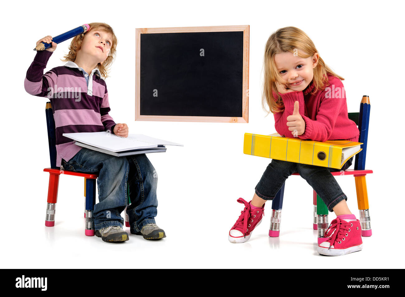 Young students seated in a chair at school Stock Photo - Alamy