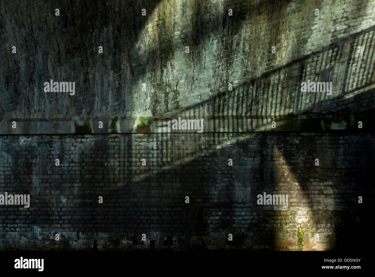 Dark sinister shadows under a bridge over the Nottingham Canal Stock ...