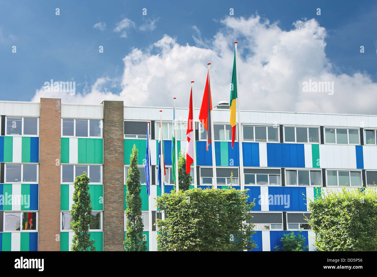 Several flags near the office building Stock Photo - Alamy