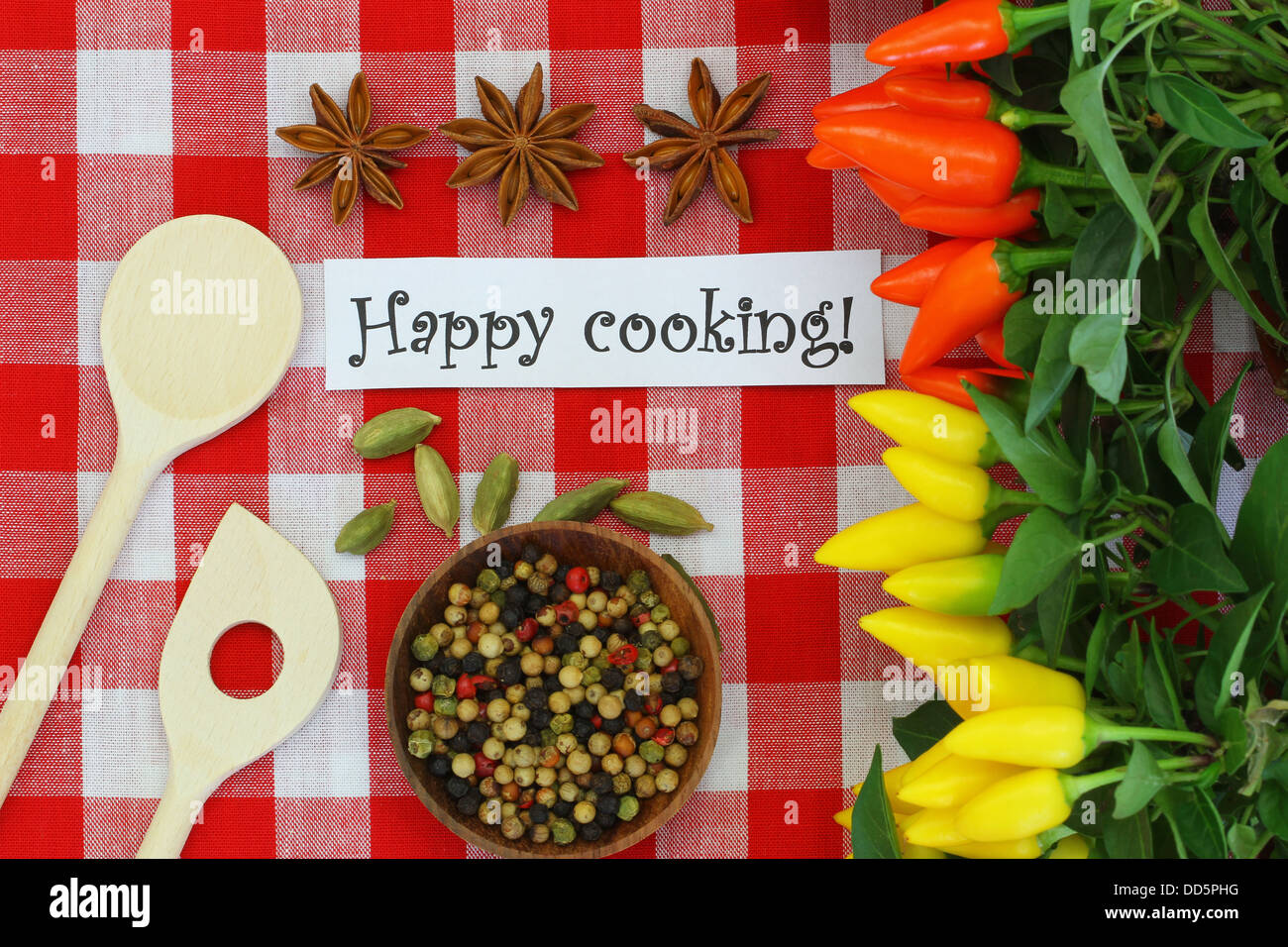 Happy cooking card with spices, chilies and wooden spoons Stock Photo ...