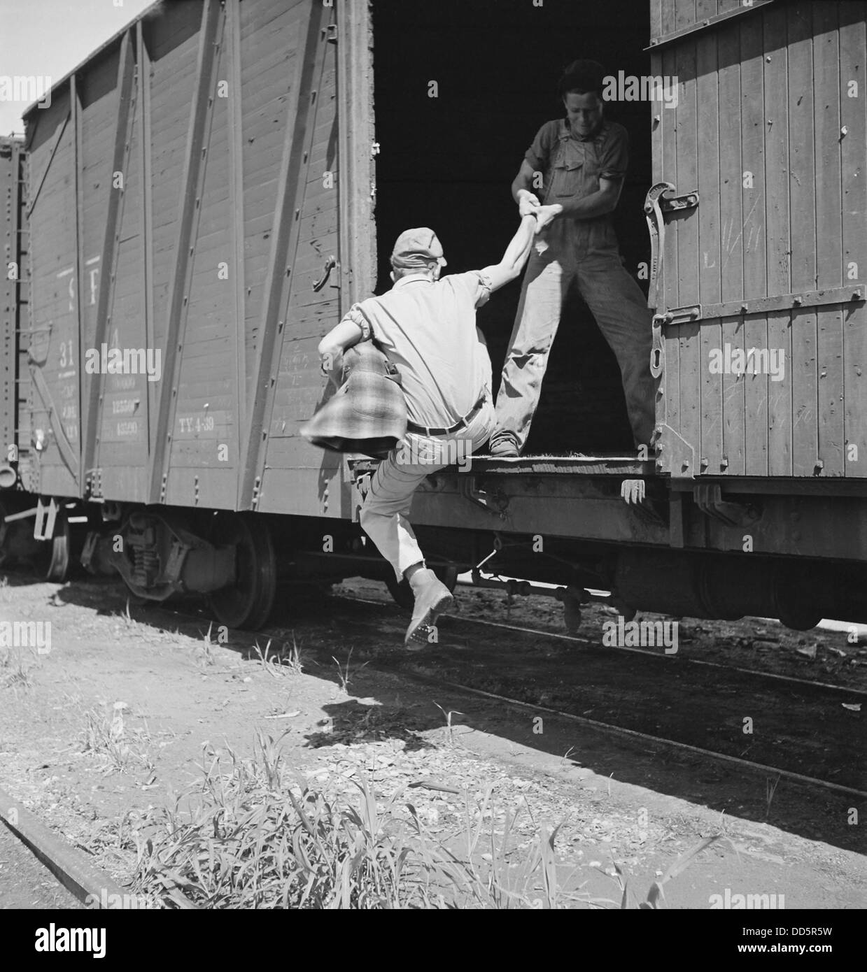 Helping a man hop a freight at Bakersfield, California, 1930s. (BSLOC ...