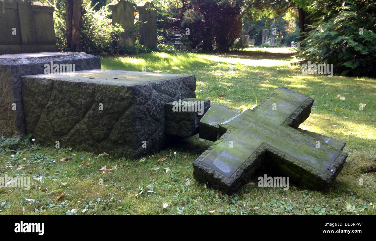 HANDOUT - A handout photo dated 27 August 2013 shows overturned grave ...
