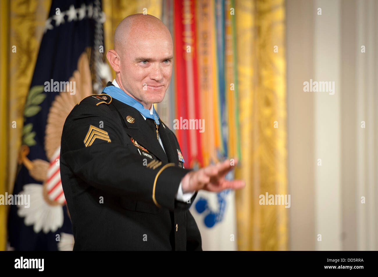 US Army Staff Sgt. Ty Michael Carter waves to his family after ...