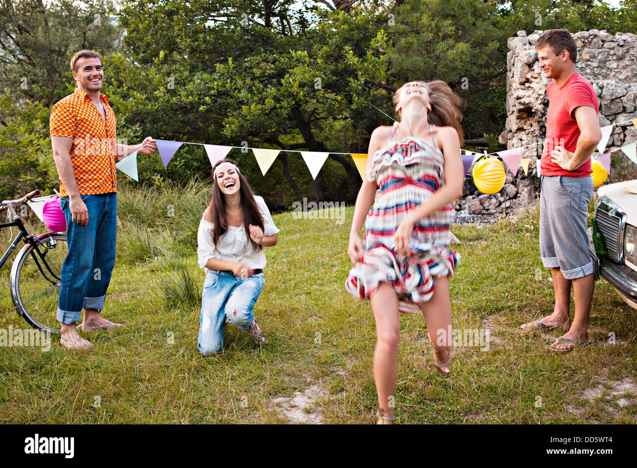 Croatia, Dalmatia, Young women dancing outdoors, men watching Stock ...