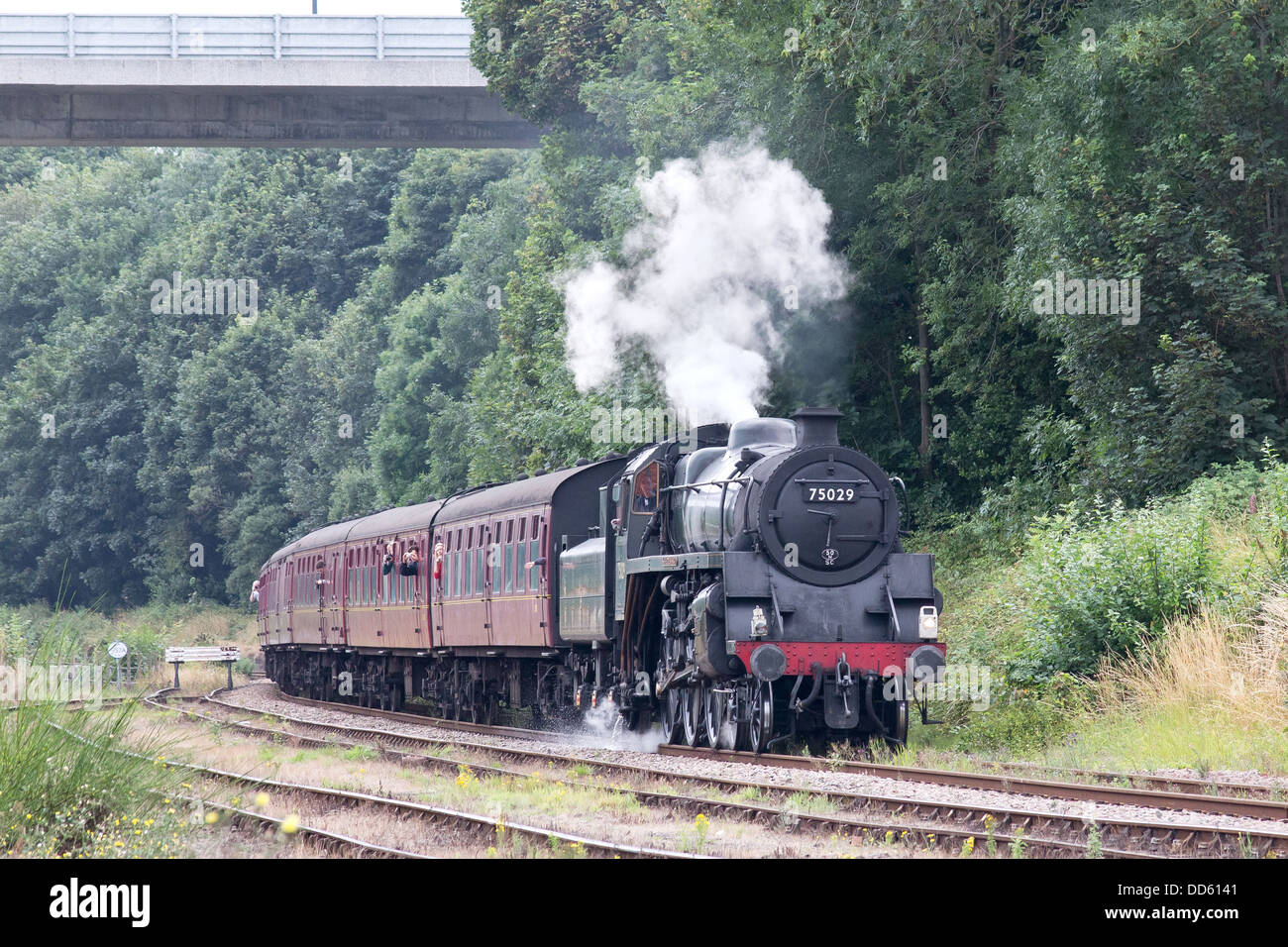Steam locomotive pulling a passenger train on the North Yorkshire Moors ...