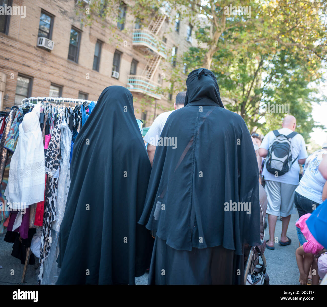 Islamic women in full burqas walk through the Brighton Beach Jubilee in ...