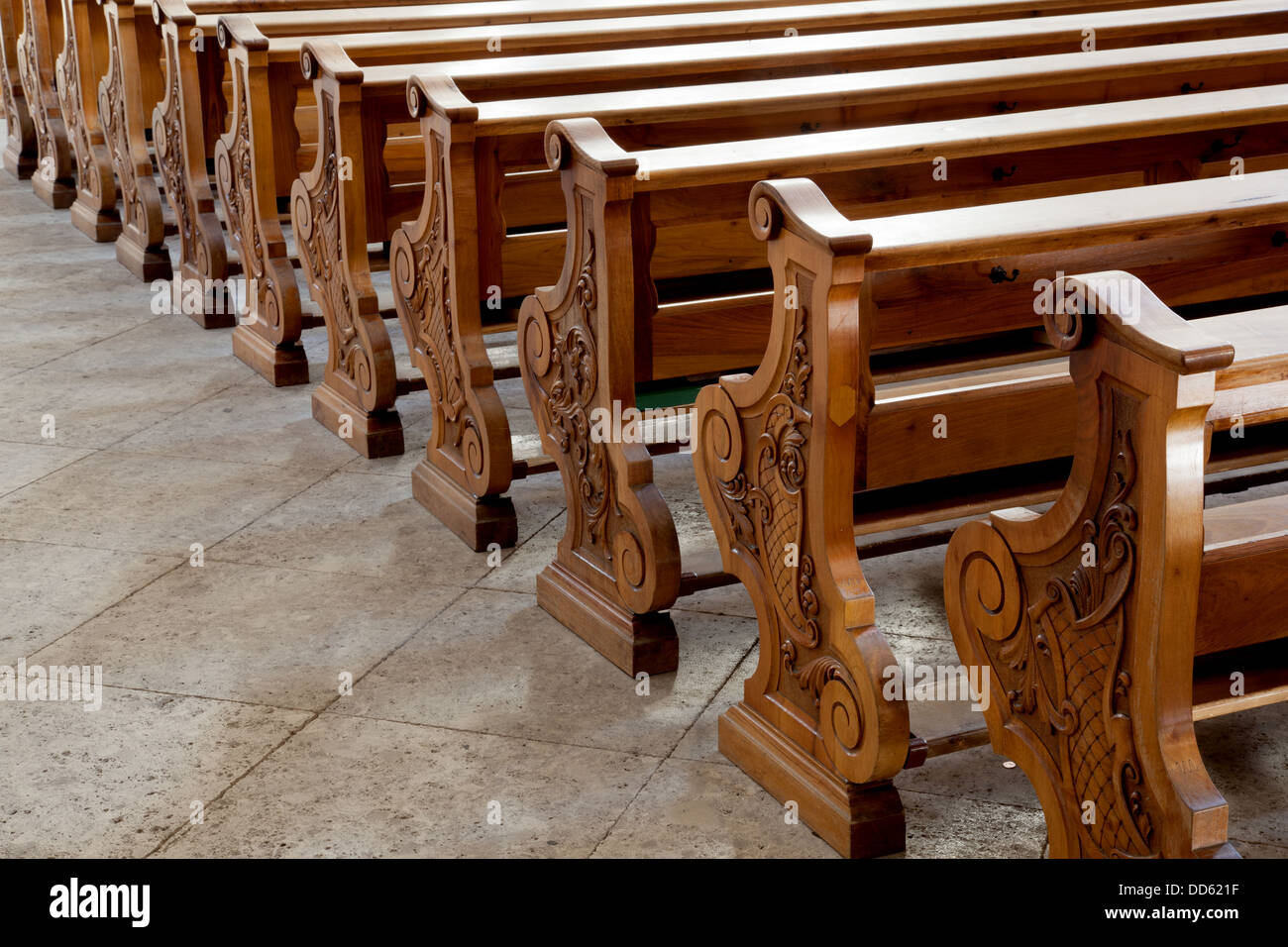 benches in catholic curch at cortina d'ampezzo in the italian dolomites ...