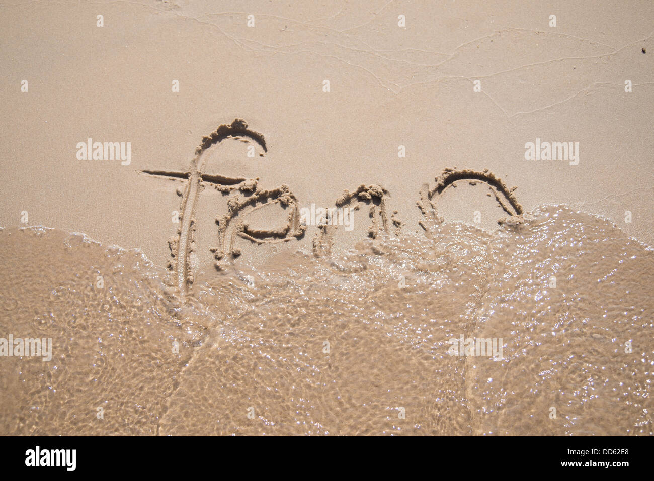 The word "fear" written in the sand Stock Photo - Alamy