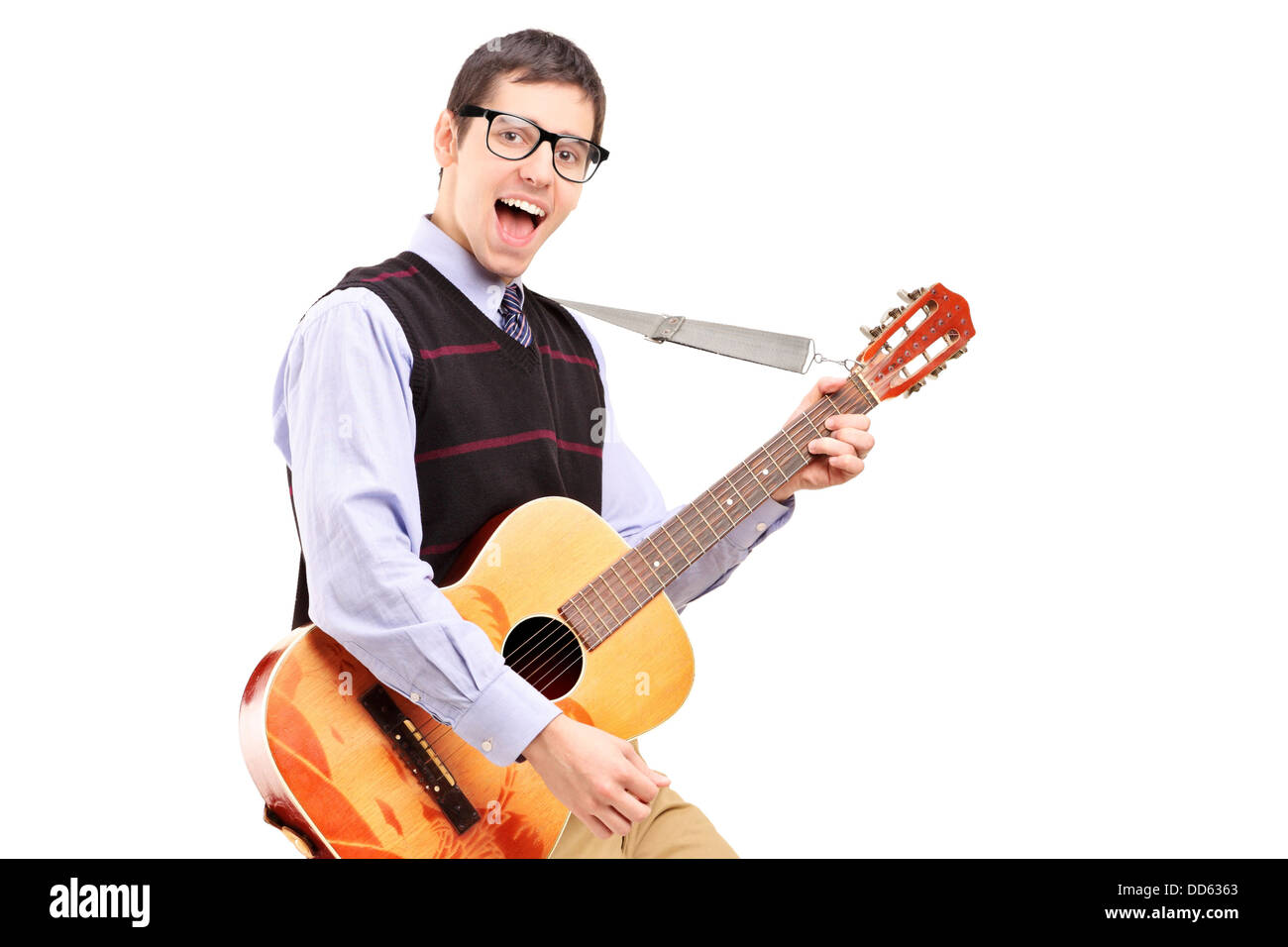 Happy male playing a guitar Stock Photo - Alamy