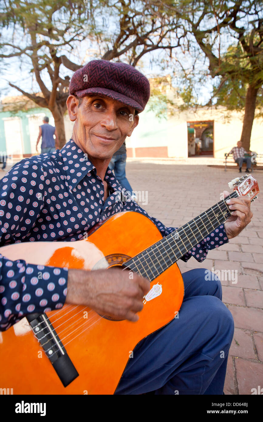 Cuba, Man playing guitar, smiling Stock Photo - Alamy