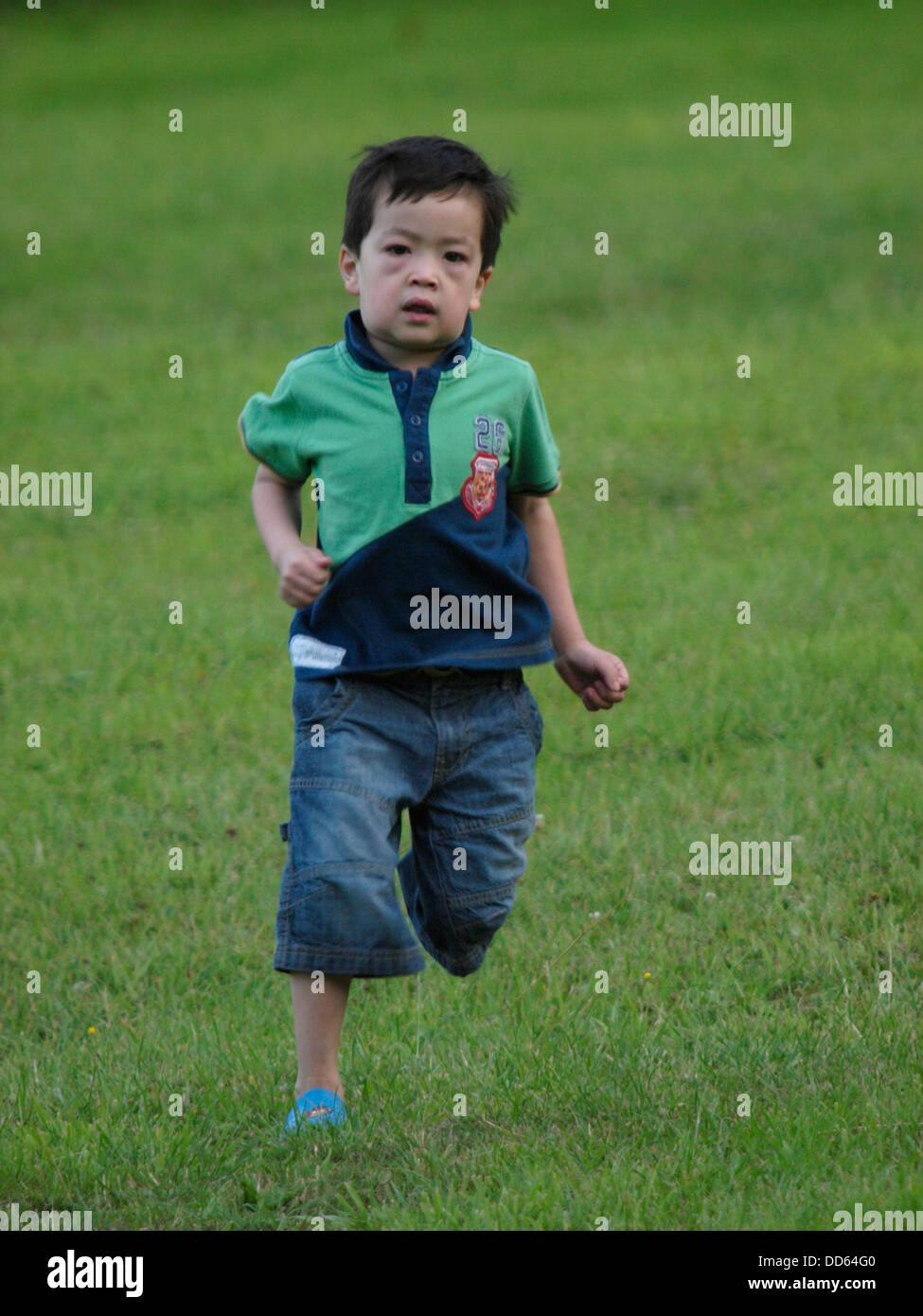 Young British Asian boy running, UK 2013 Stock Photo - Alamy