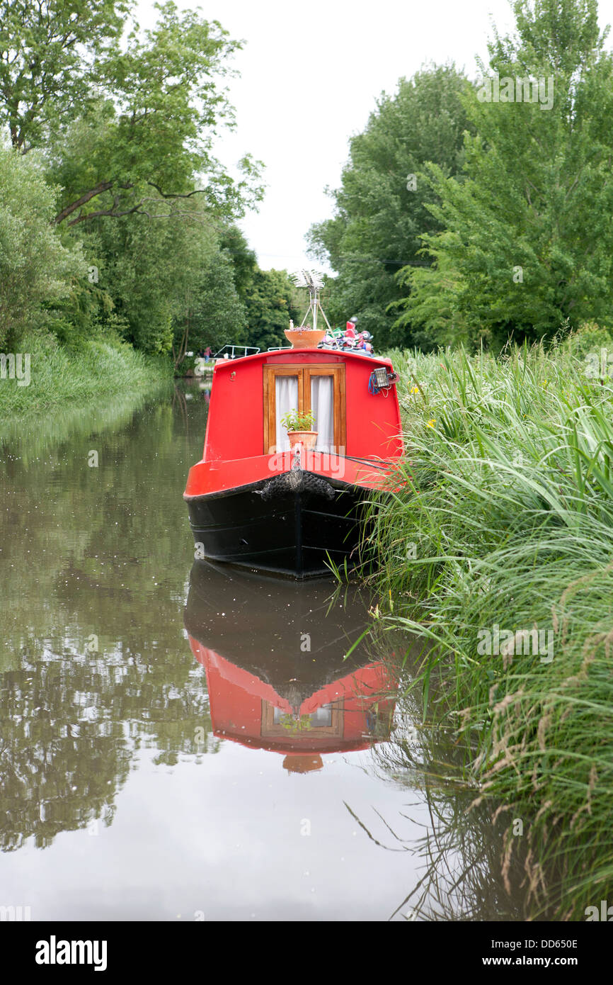 A red narrow boat (Barge) moored on the Kennet and Avon canal, it is ...