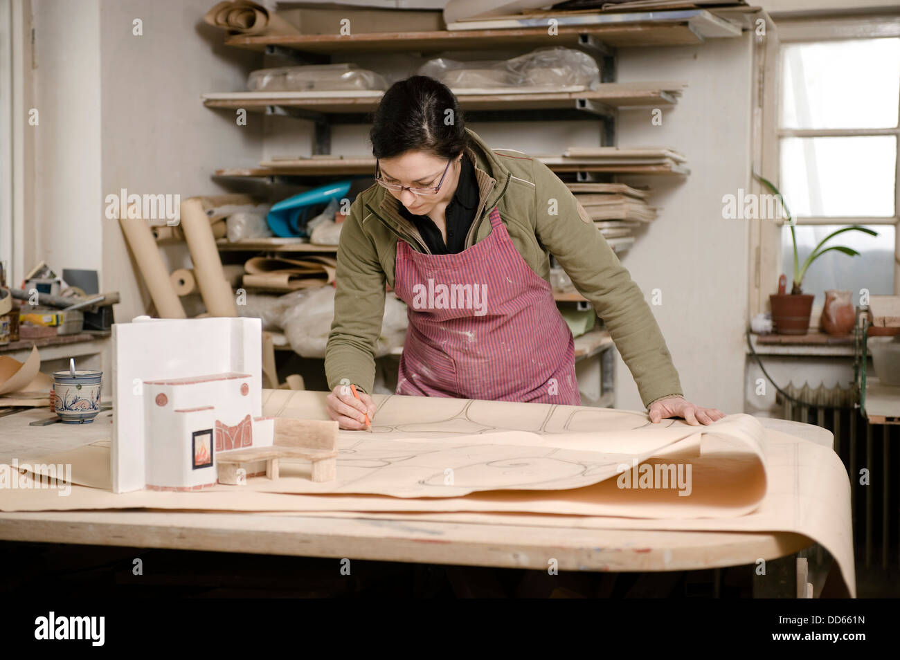 Mid adult woman outlining on paper hi-res stock photography and images ...