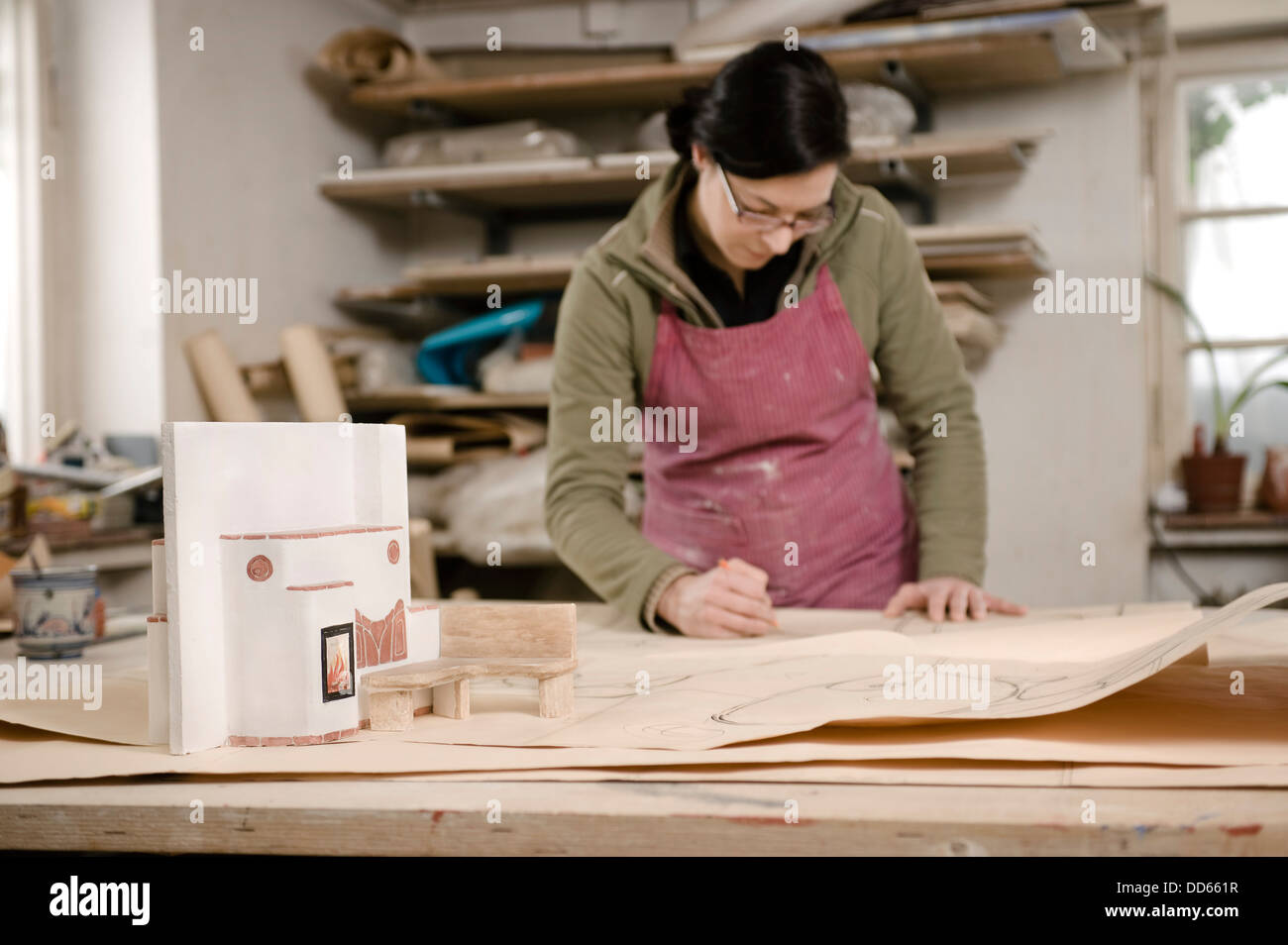 Mid adult woman outlining on paper hi-res stock photography and images ...