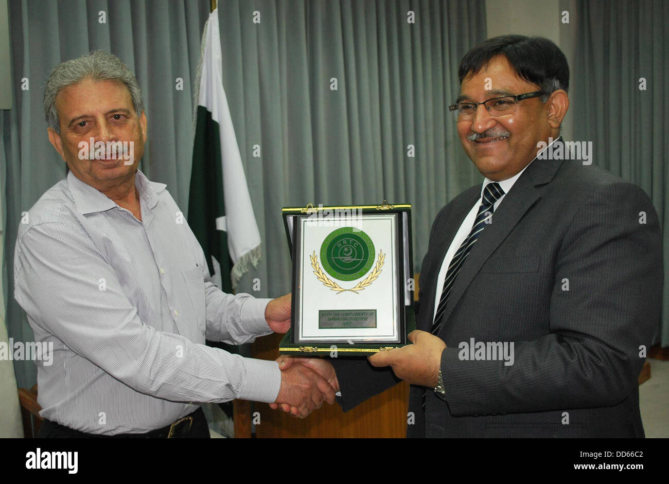 ISLAMABAD/ PAKISTAN . 27 august 2013 MD NRTC presenting a shield to ...