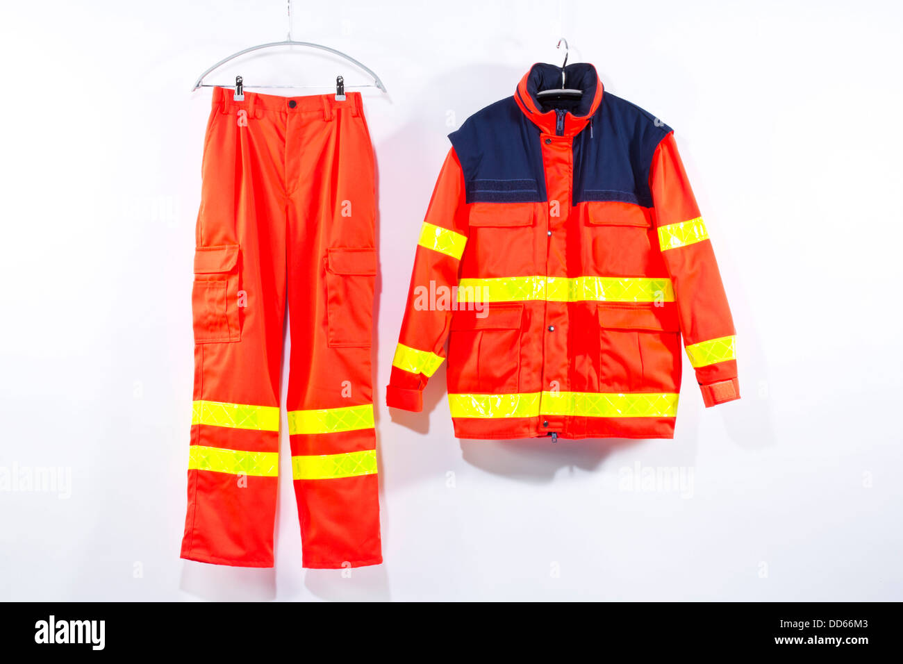 Rescue service uniform hanging against white background Stock Photo - Alamy