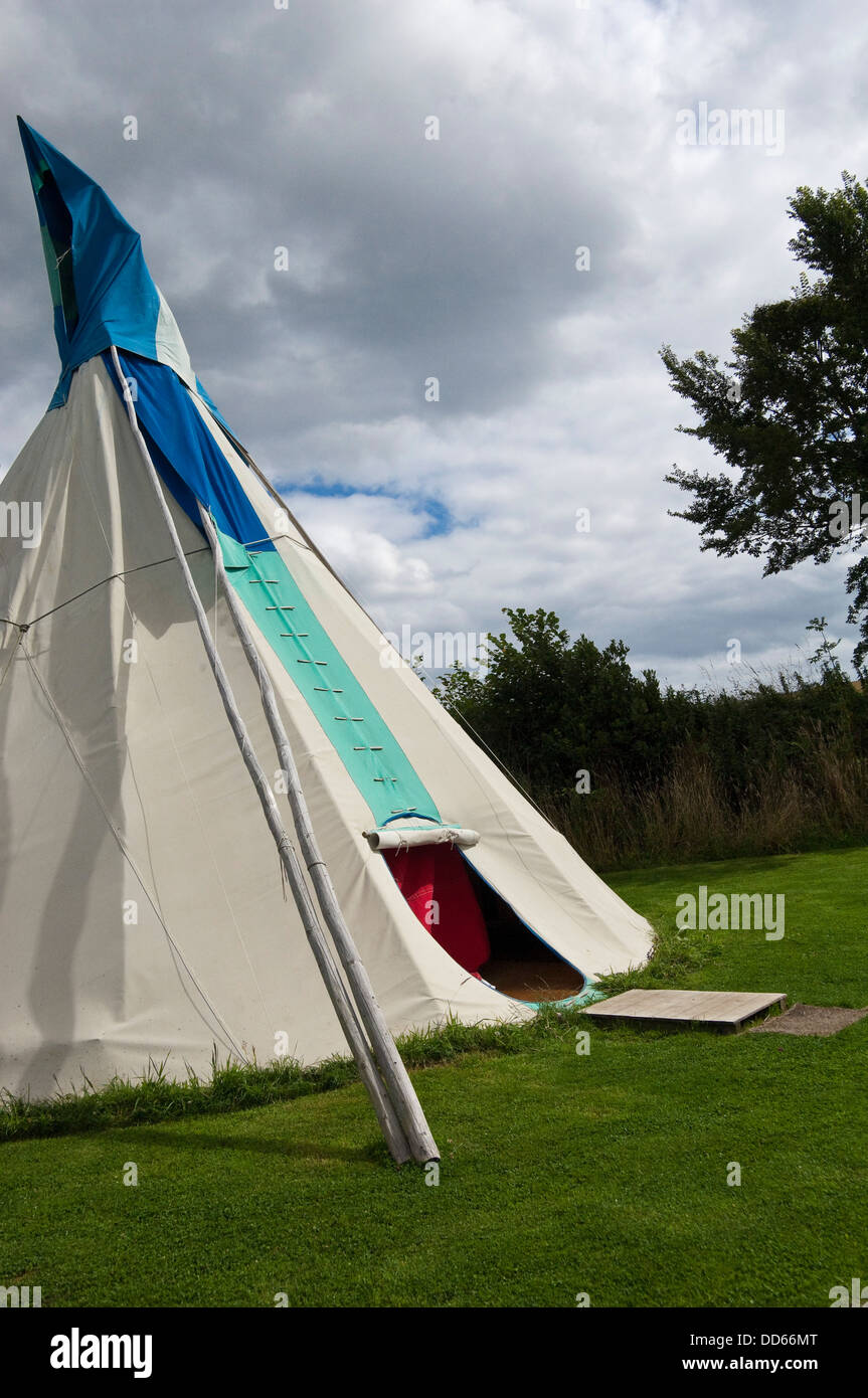 Vertical view of an erected new tepee tent in a field Stock Photo - Alamy