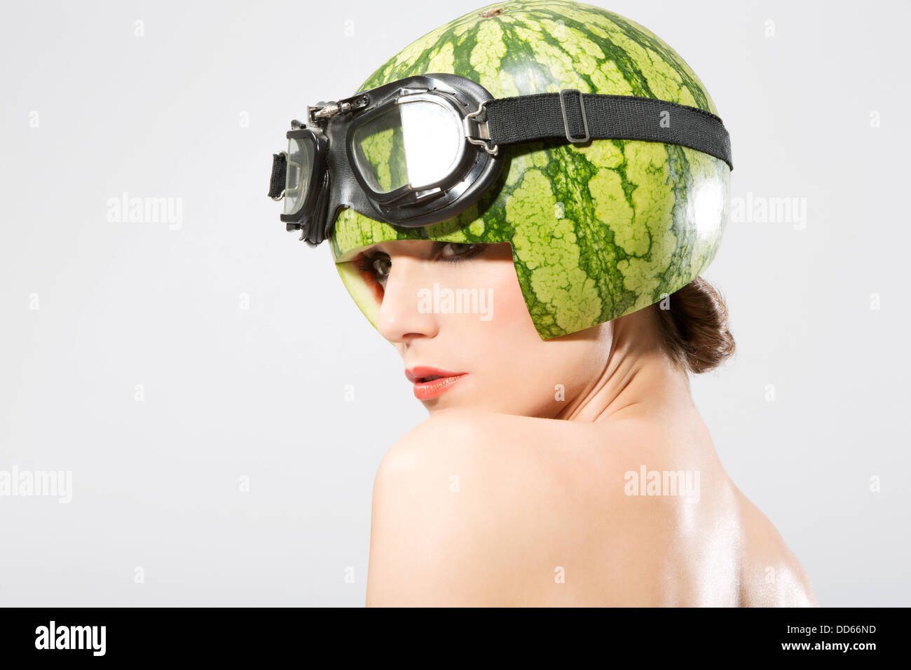 Young woman wearing watermelon helmet, close up Stock Photo - Alamy