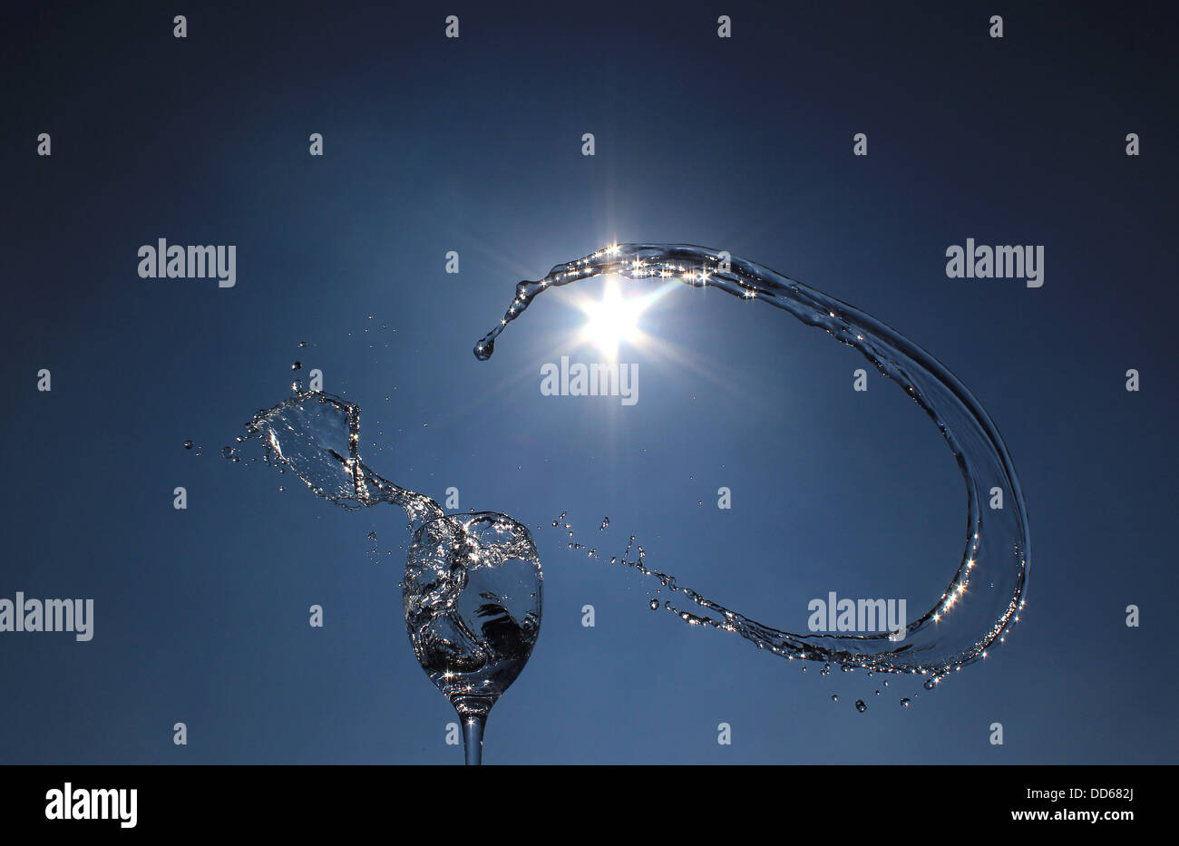 Water splashing from wine glass Stock Photo - Alamy
