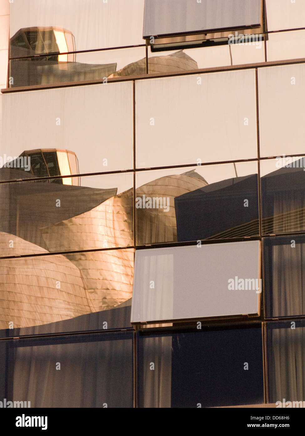 GUGGENHEIM MUSEUM OF MODERN ART (©FRANK GEHRY 1997) REFLECTED IN GLASS ...